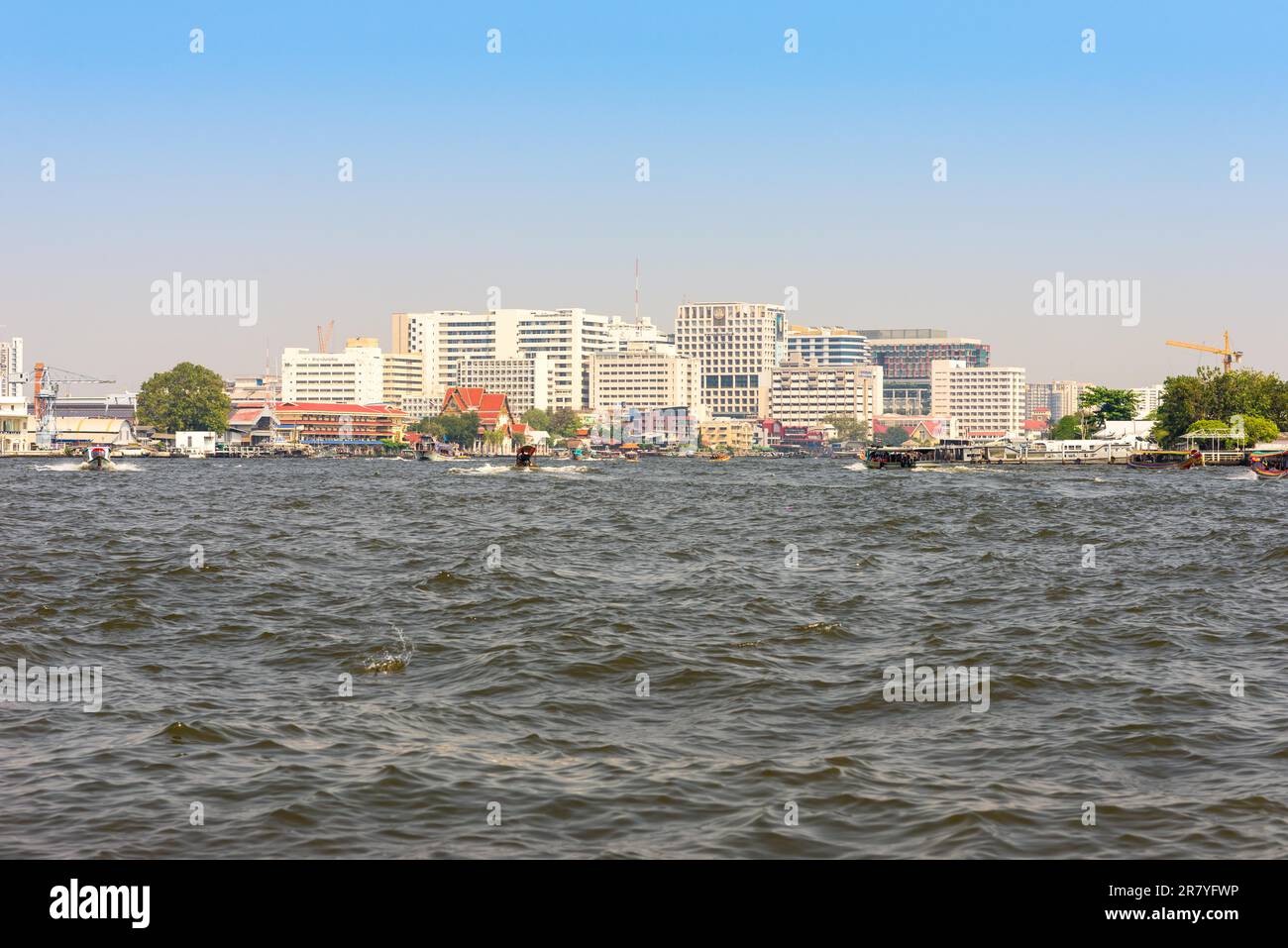 Ships and boats on the Chao Phraya, a major river in Thailand. The ...