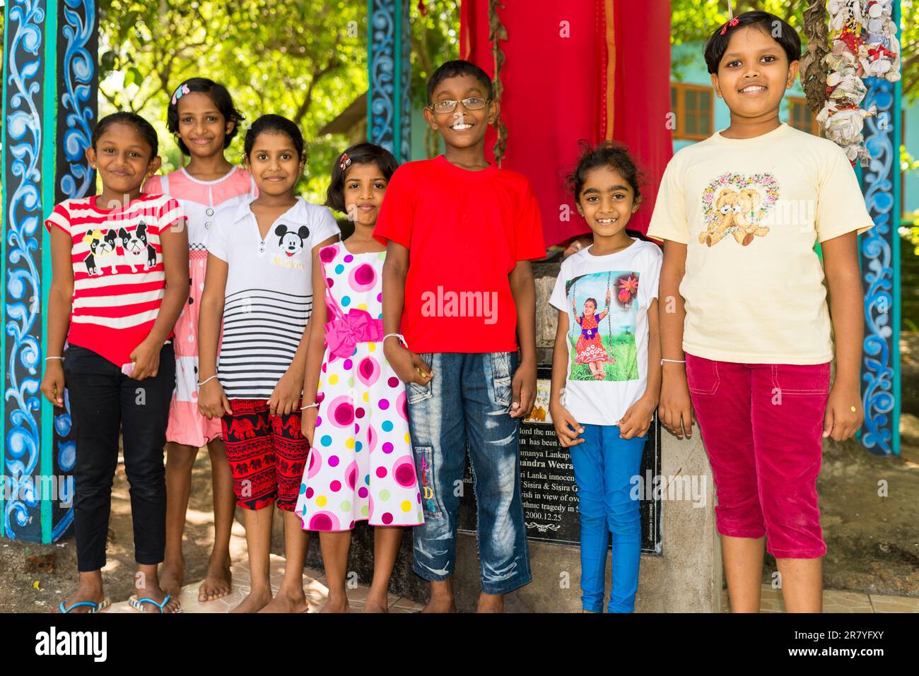 Kids in a row at the foot of the Hanuman statue on the Rumassala hill ...