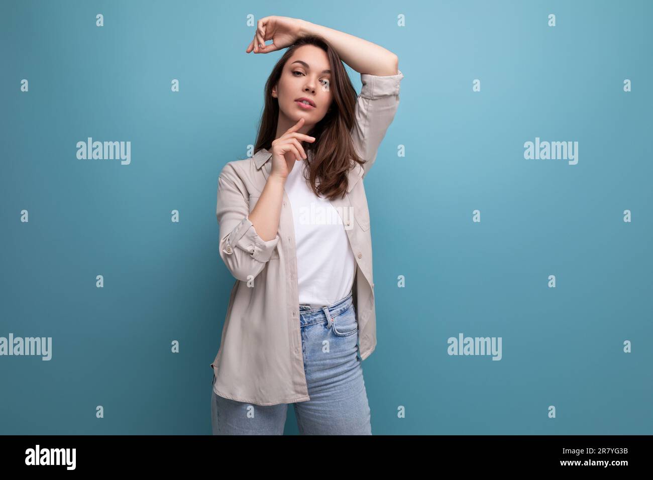 pretty 25 year old woman in casual look posing professionally in studio ...
