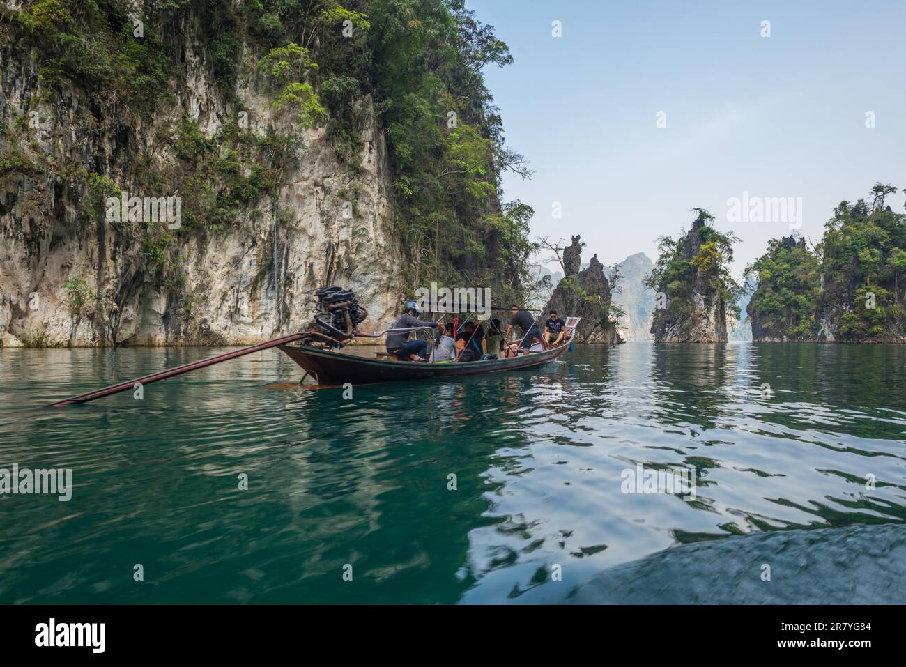 Tourists in a long-tail boat at the Khao Sam Kler limestone rocks, in ...