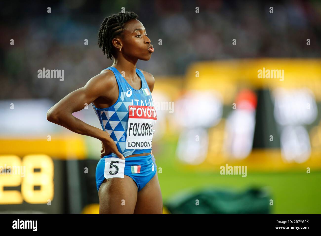 Ayomide Folorunso participating in the 400 meters hurdles at the World ...