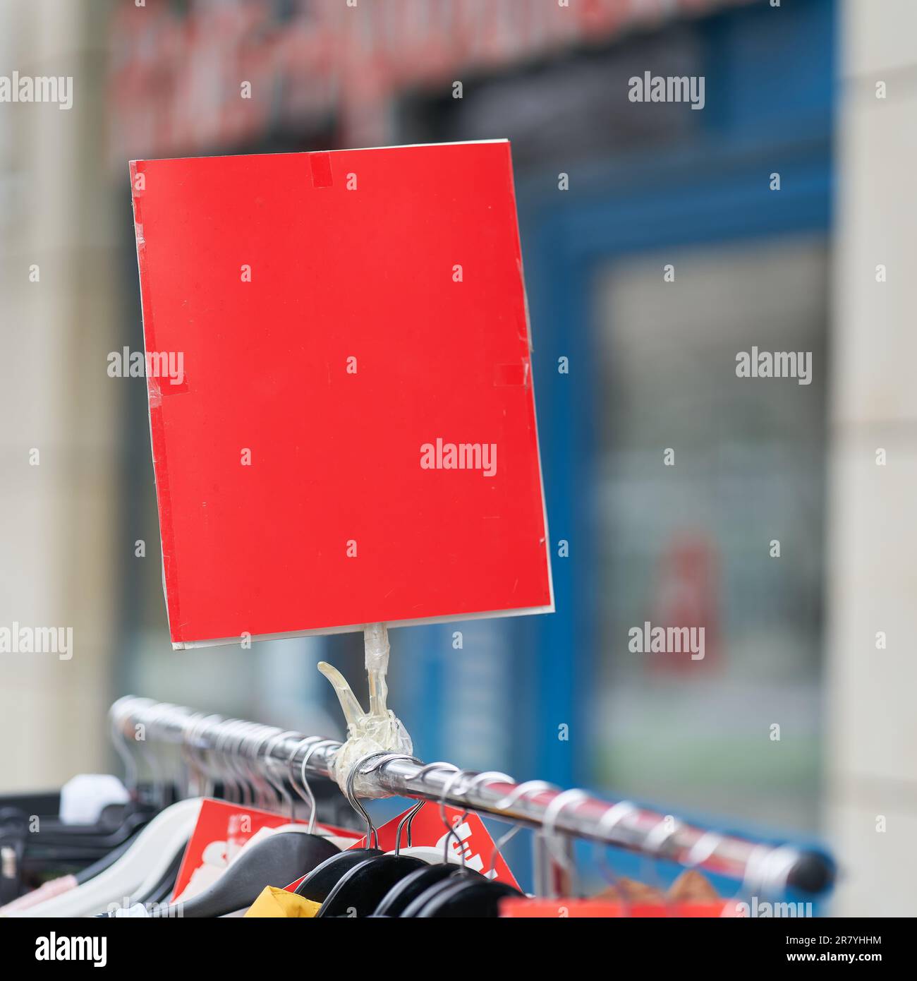 Empty red blank sign with text space in front of a shop Stock Photo - Alamy