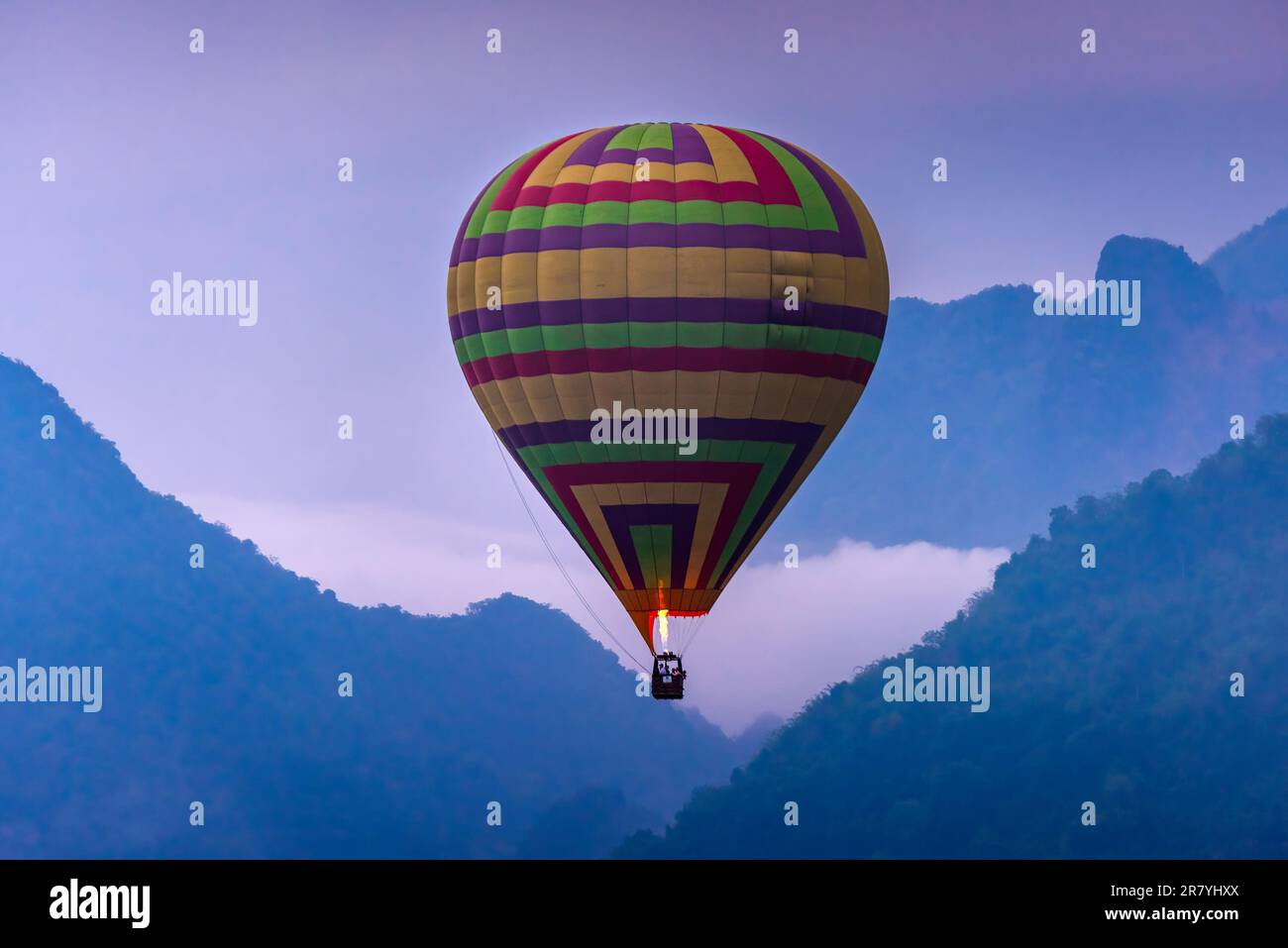 Hot air Balloon float over Misty Mountain in Vang Vieng, Laos Stock ...