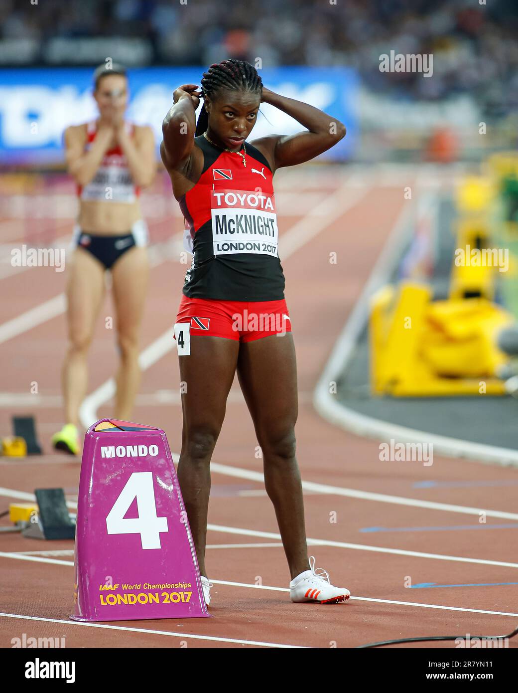 Sparkle McKnight participating in the 400 meters hurdles at the World ...