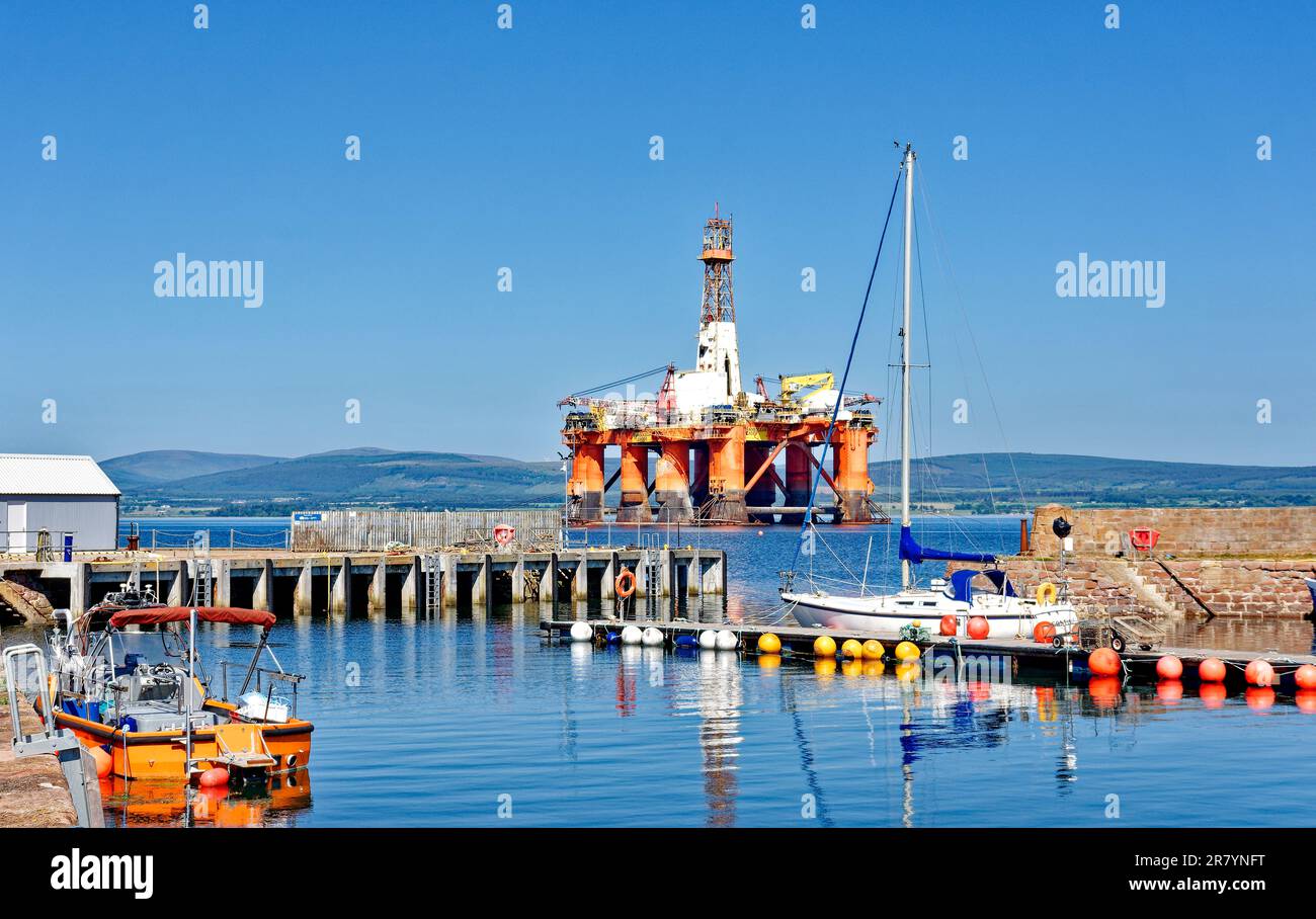 Cromarty Town Scotland the small harbour a yacht and large oil rig in ...
