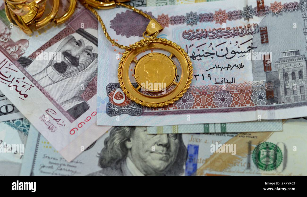 American dollars, Egyptian pounds and Saudi Arabia Riyals banknotes ...