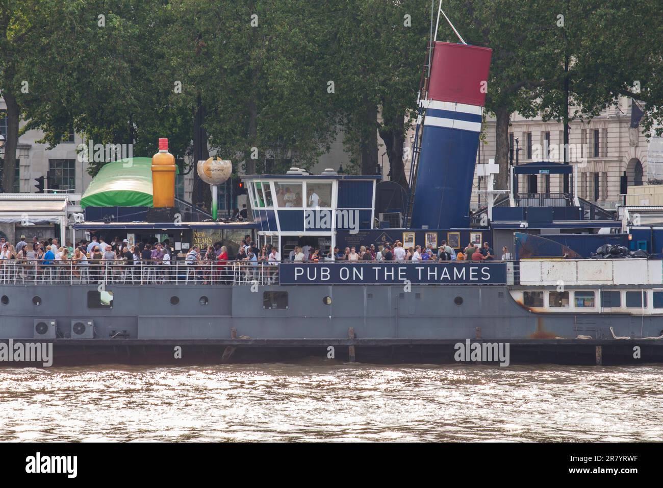 People enjoying boat drinks on the Thames on a floating pub Stock Photo ...