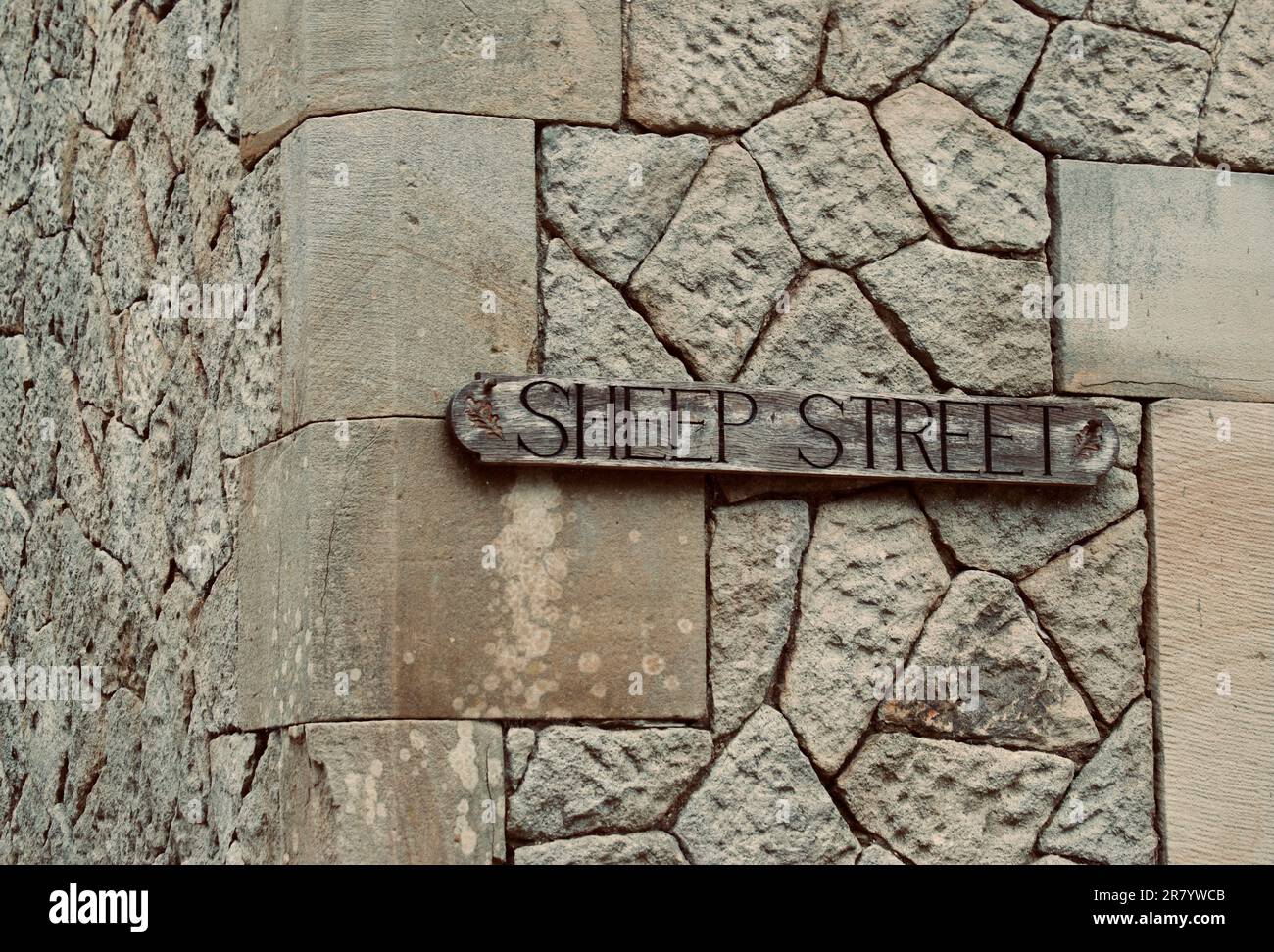 Street sign on stone wall hi-res stock photography and images - Alamy