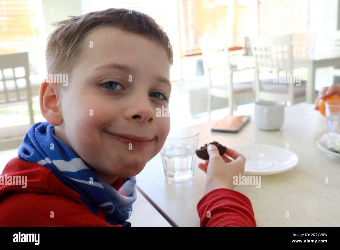 Child pastry eating cafe hi-res stock photography and images - Alamy