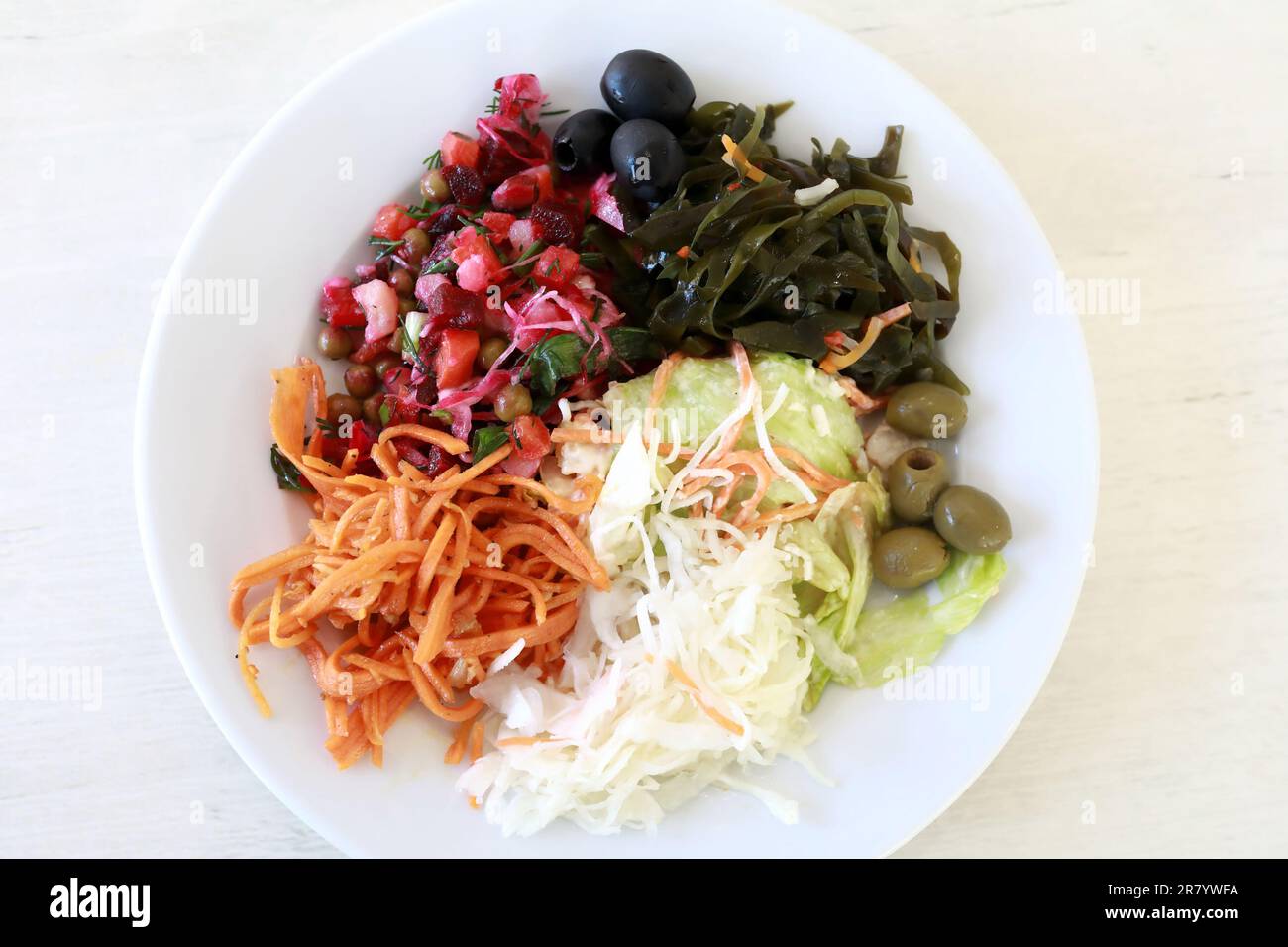 Mixed vegetable salads on plate in restaurant Stock Photo - Alamy