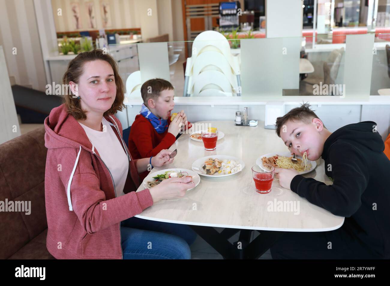 Mother son lunch in cafeteria hi-res stock photography and images - Alamy