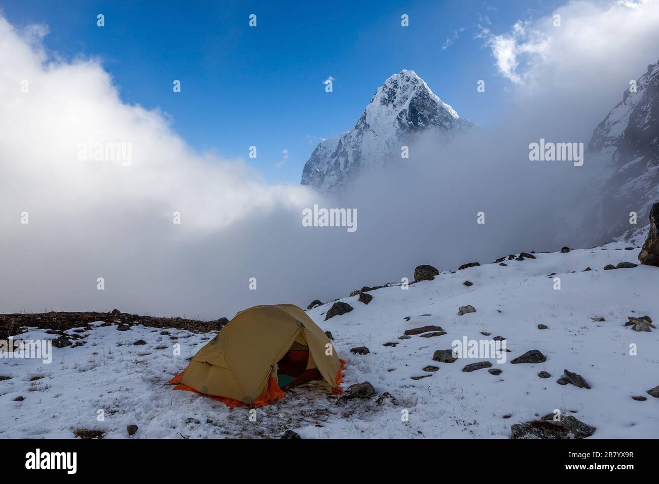 High Altitude camping in Nepal. Single yellow tent in high himalayan ...