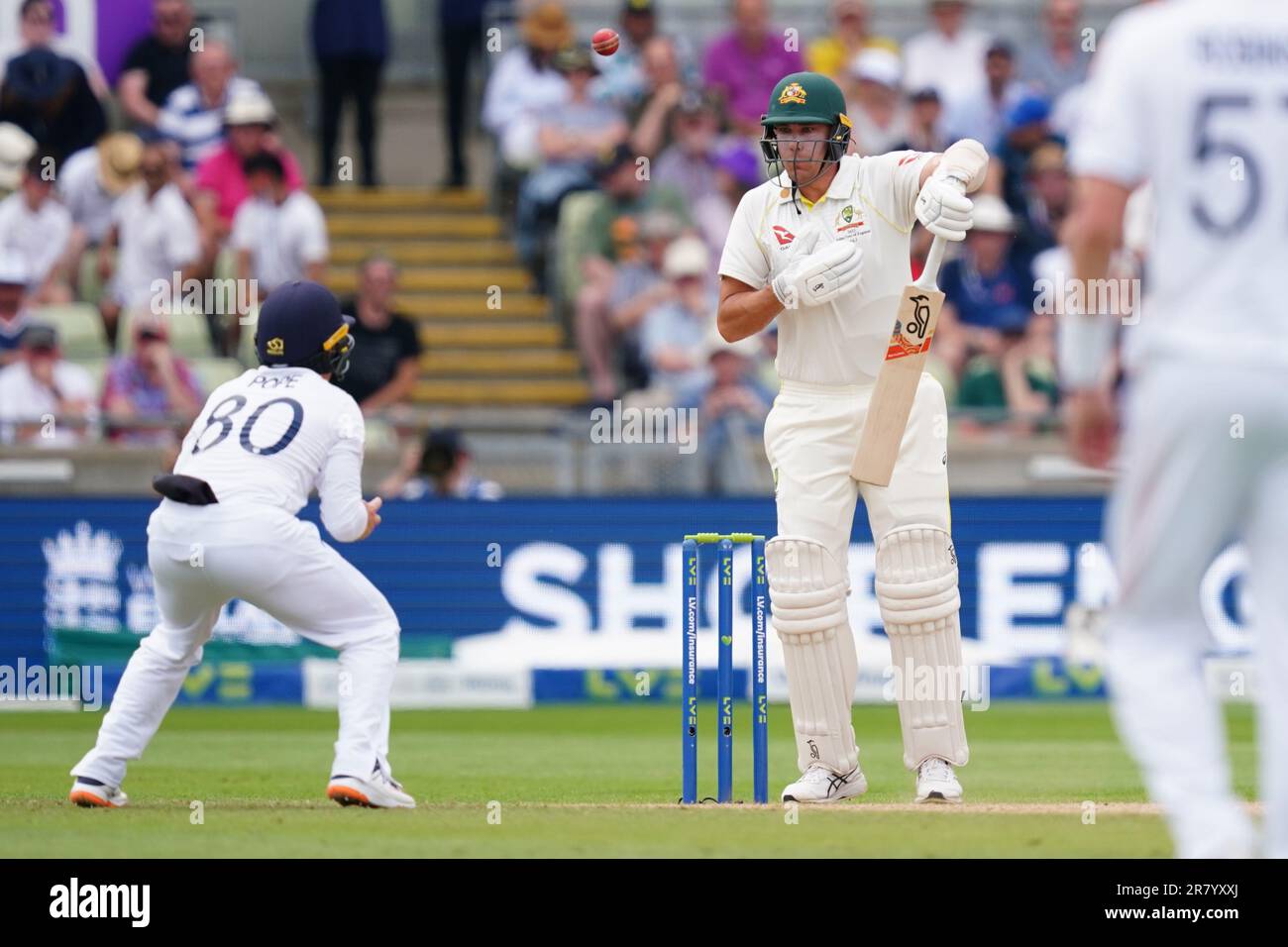 Australia’s Scott Boland pops the ball to England’s Ollie Pope (left ...
