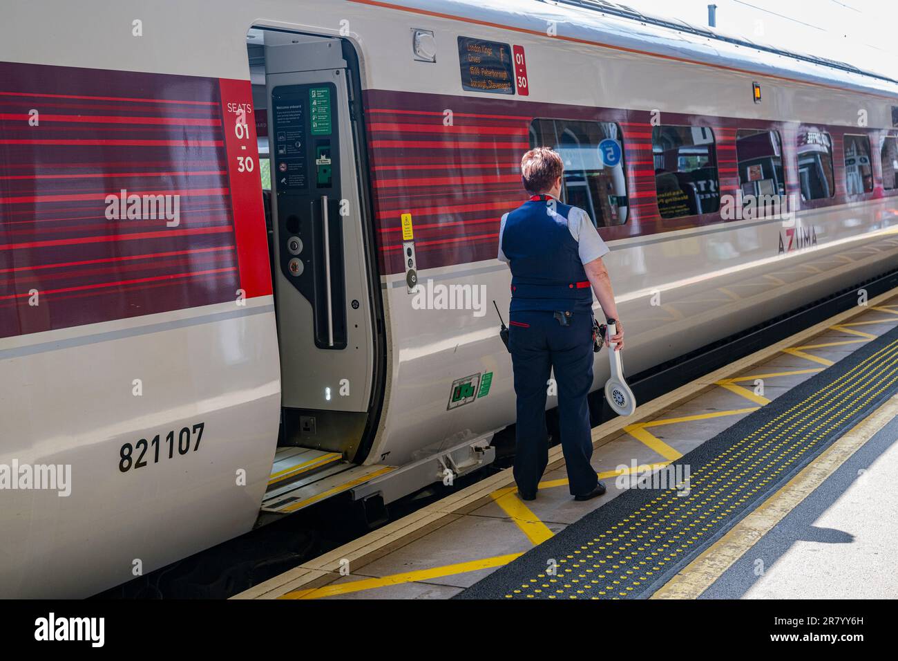 Grantham Train Station – A female conductor or guard despatching a ...