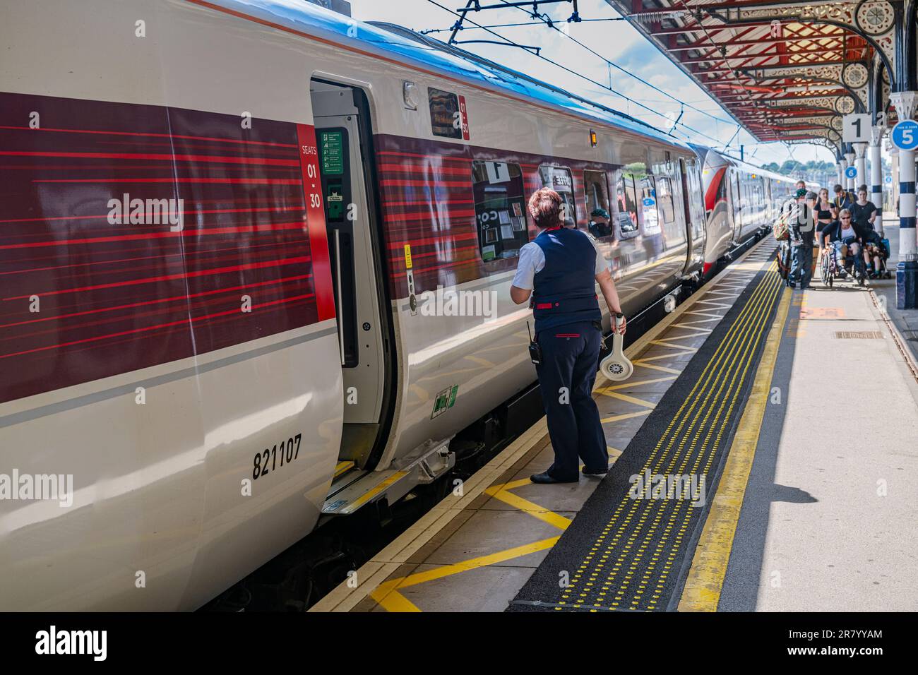 Grantham Train Station – A female conductor or guard despatching a ...