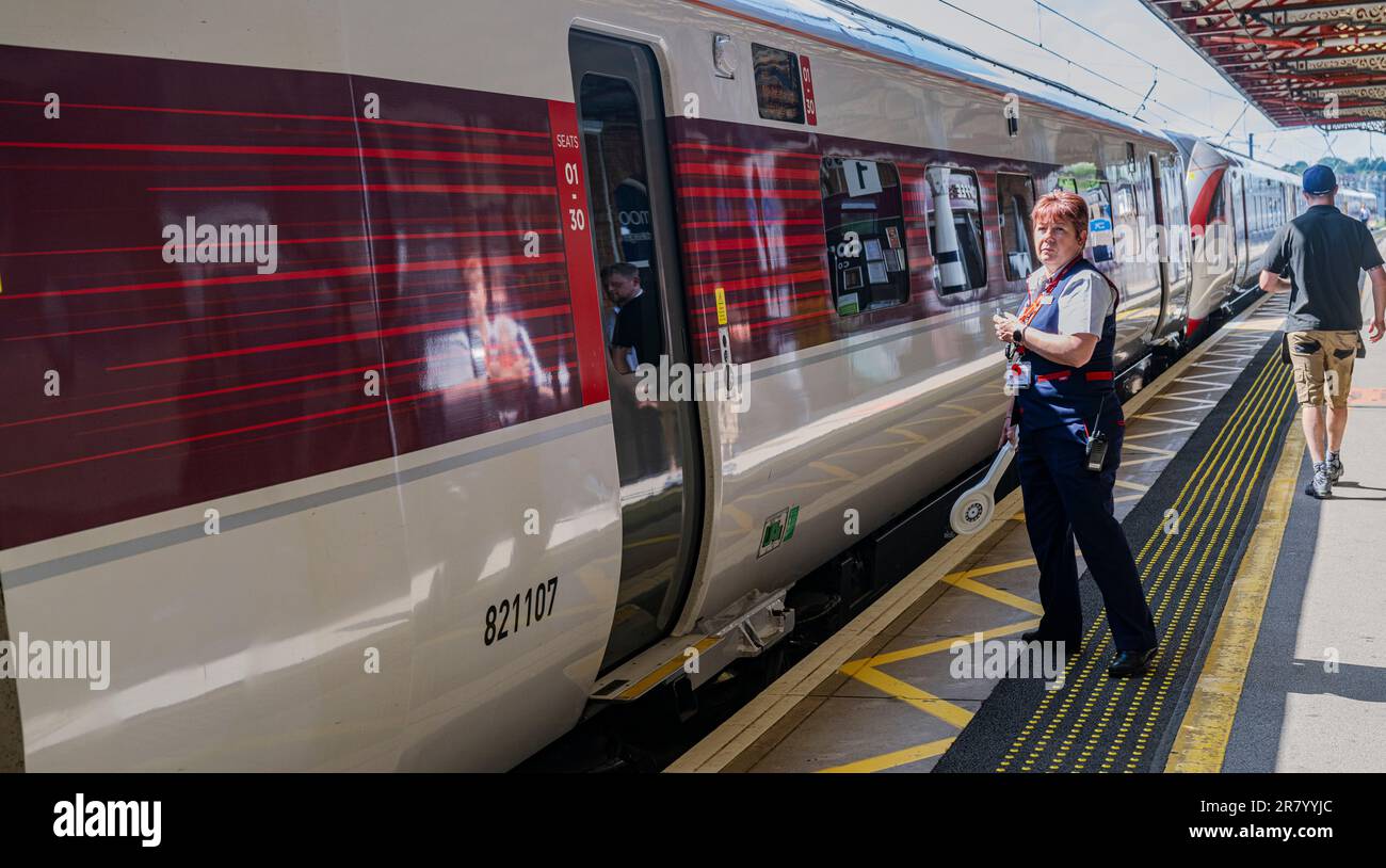 Grantham Train Station – A female conductor or guard despatching a ...