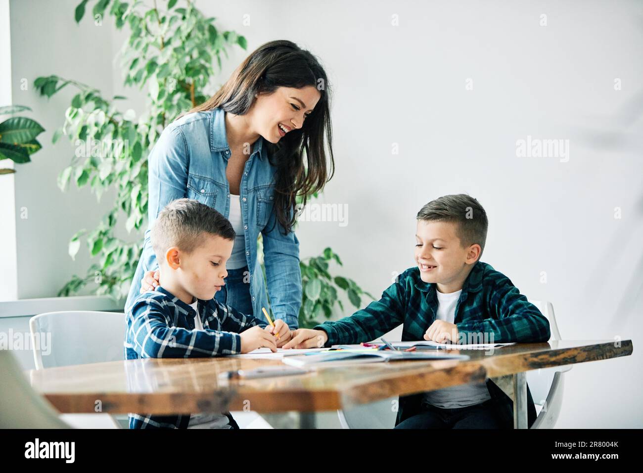 Mother helping son study hi-res stock photography and images - Alamy