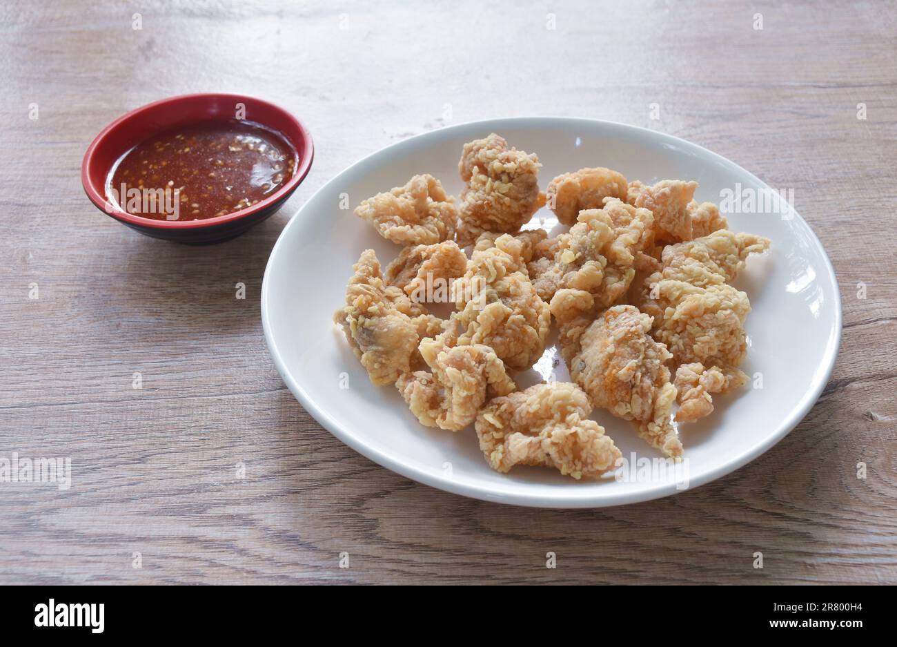 crispy fried Korean chicken with bread crumb and egg yolk on plate ...