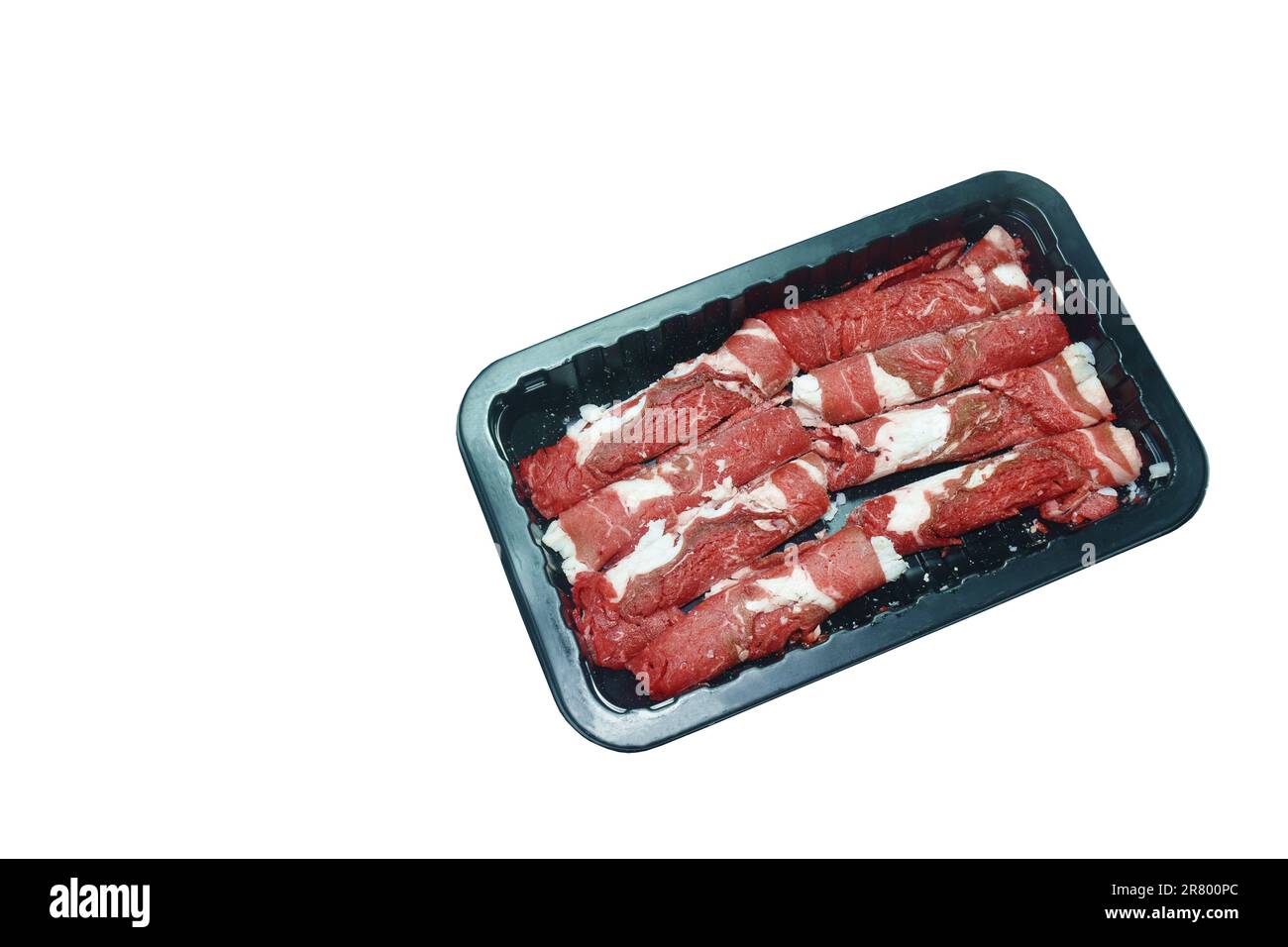 raw frozen beef meat slice roll ingredient food on plastic tray in ...