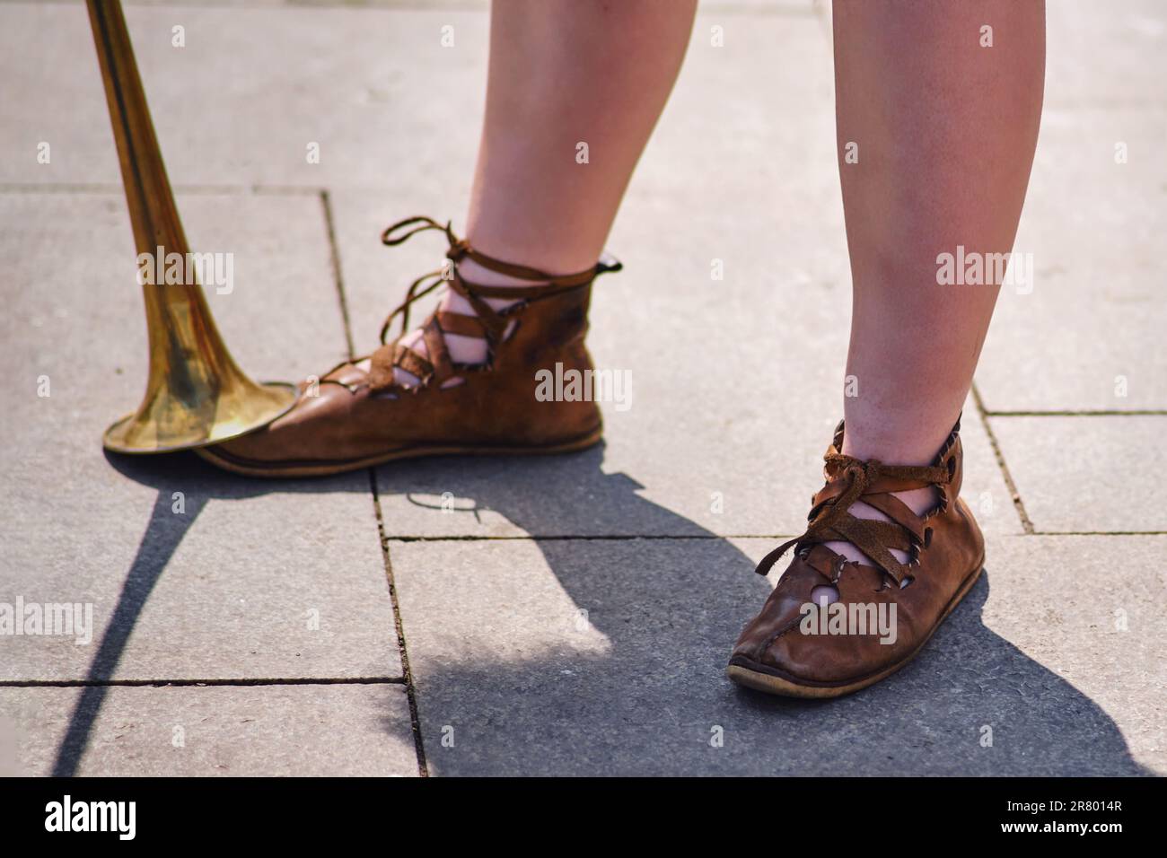 Feet in shoes of the ancient Roman war, soldiers in historical boots on ...