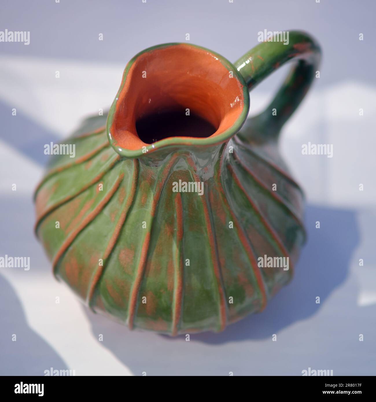 Green retro water jug. Objects of medieval European life of the 13th ...