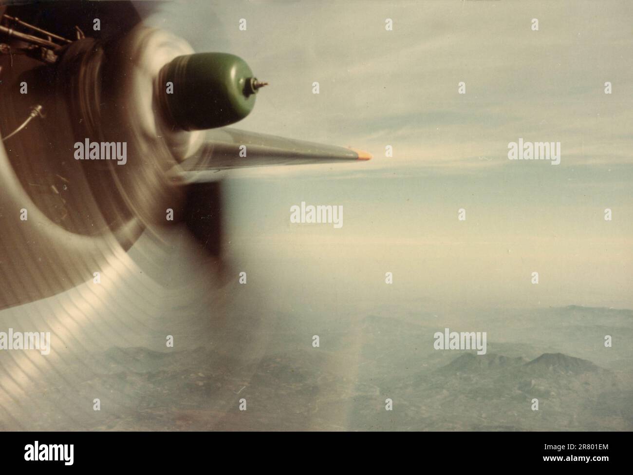Aircraft propeller spinning during the flight over the mountain, Italy ...