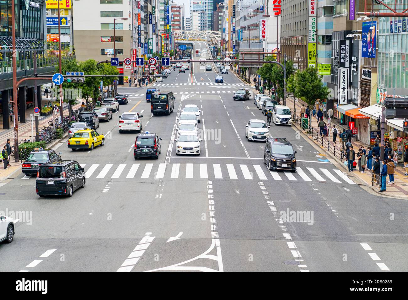 View along Route 176 in Umeda, Osaka. Typical urban scene with high ...
