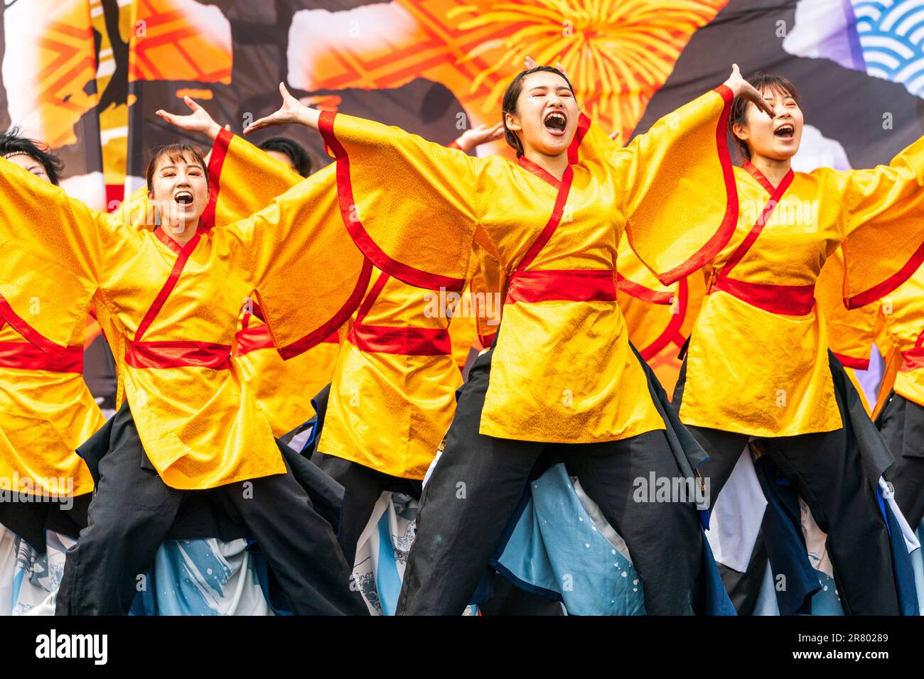 Close up of a row of Japanese Yosakoi dancers wearing long sleeved ...