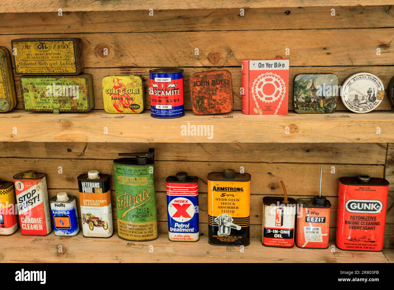A collection of metal tins that used to contain DIYand garage fluids ...