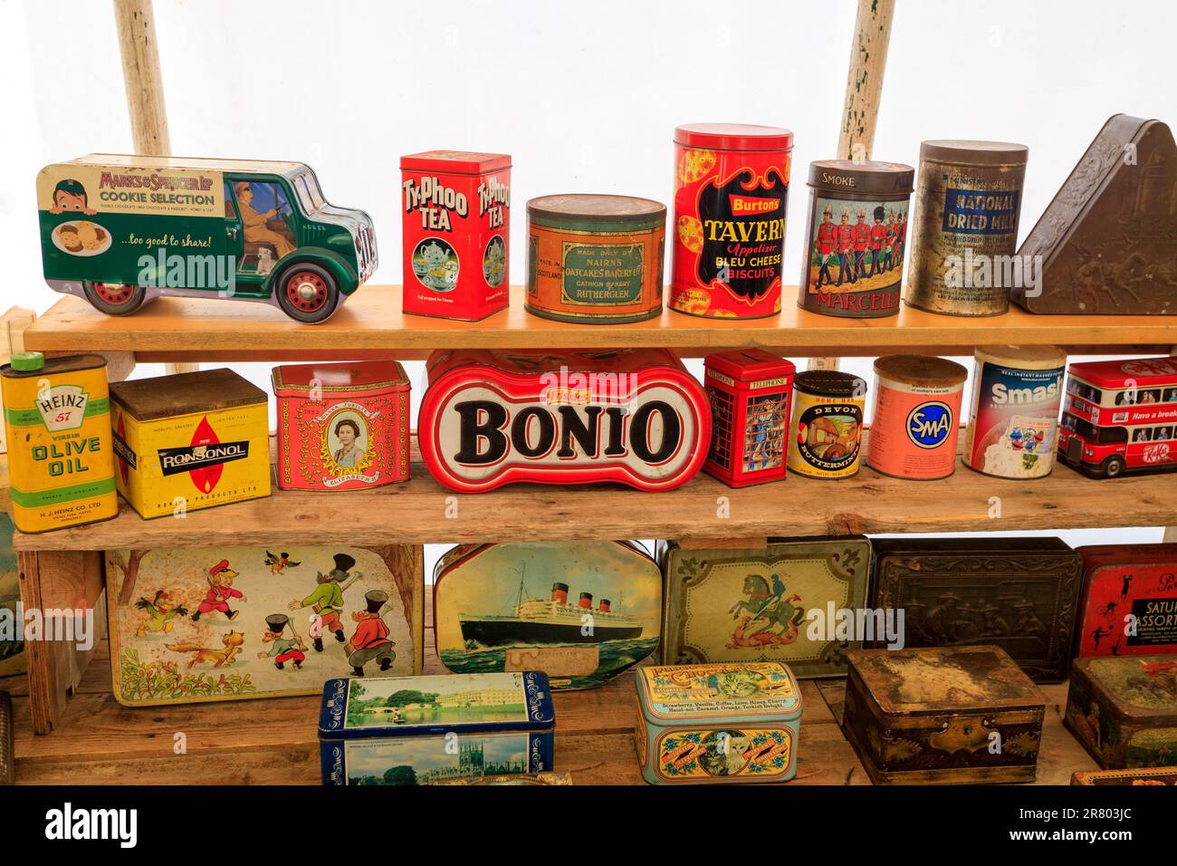A collection of metal tins that used to contain different foods from ...