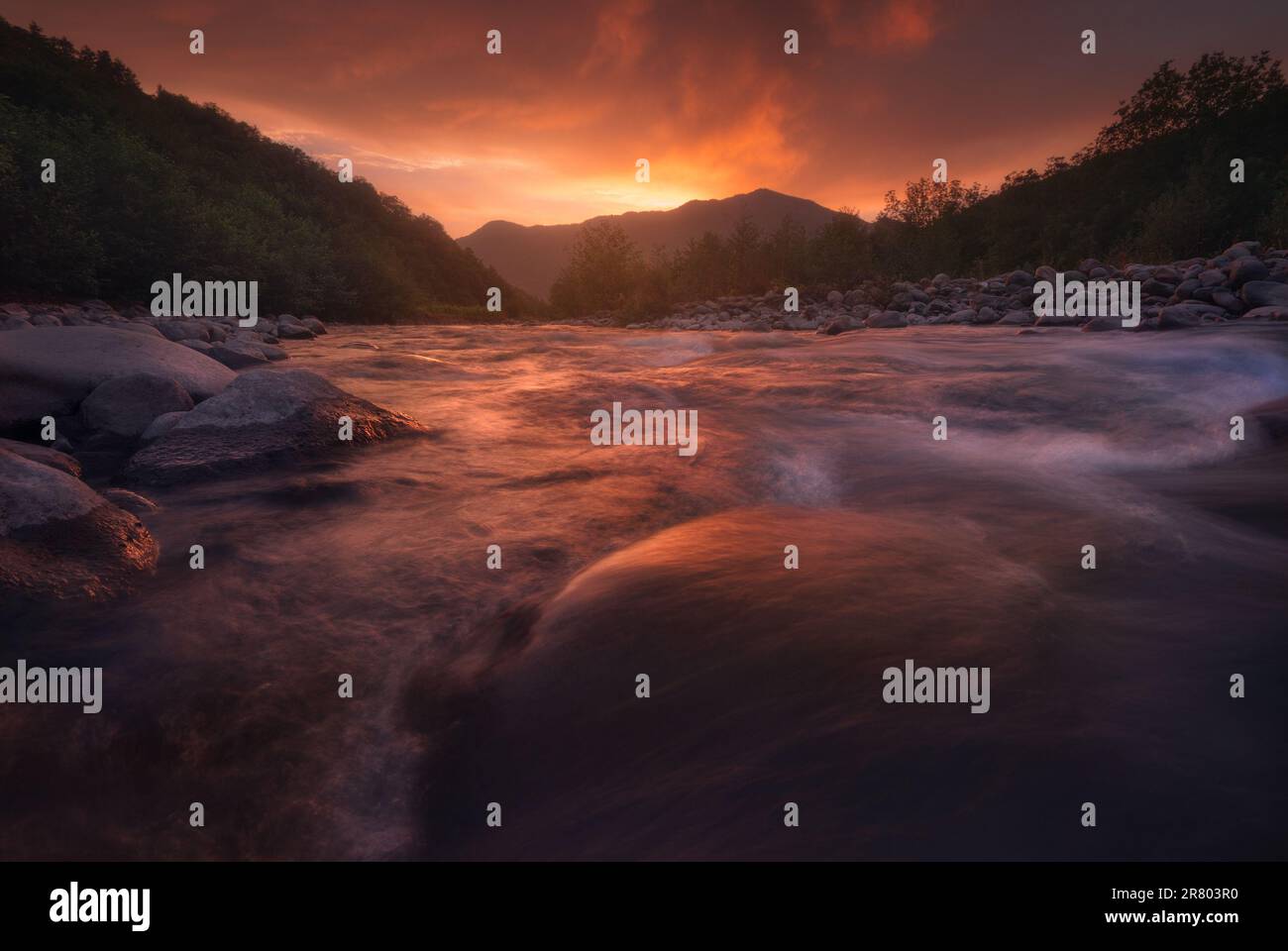 beautiful sunrise over fast flowing mountain river Stock Photo - Alamy