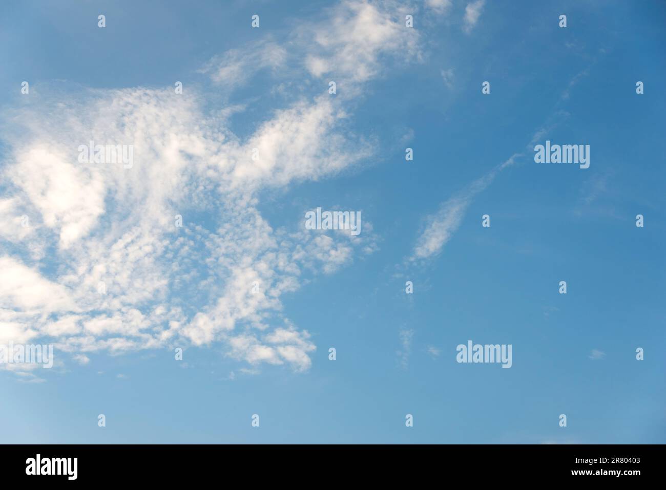Scattered cloud clusters in a blue sky, blue sky background with white ...