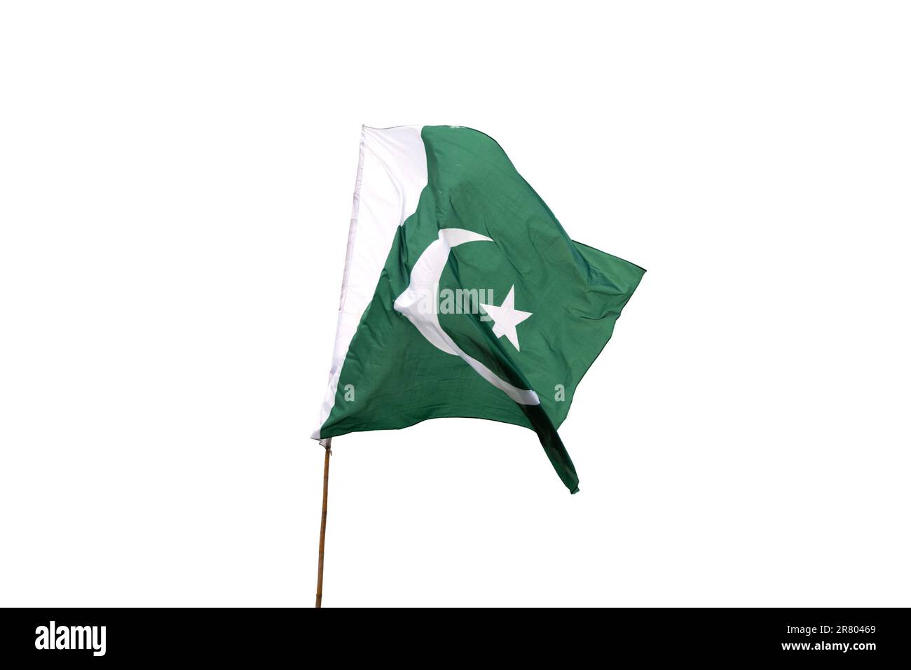 Pakistan's national flag flies in the sky Stock Photo - Alamy