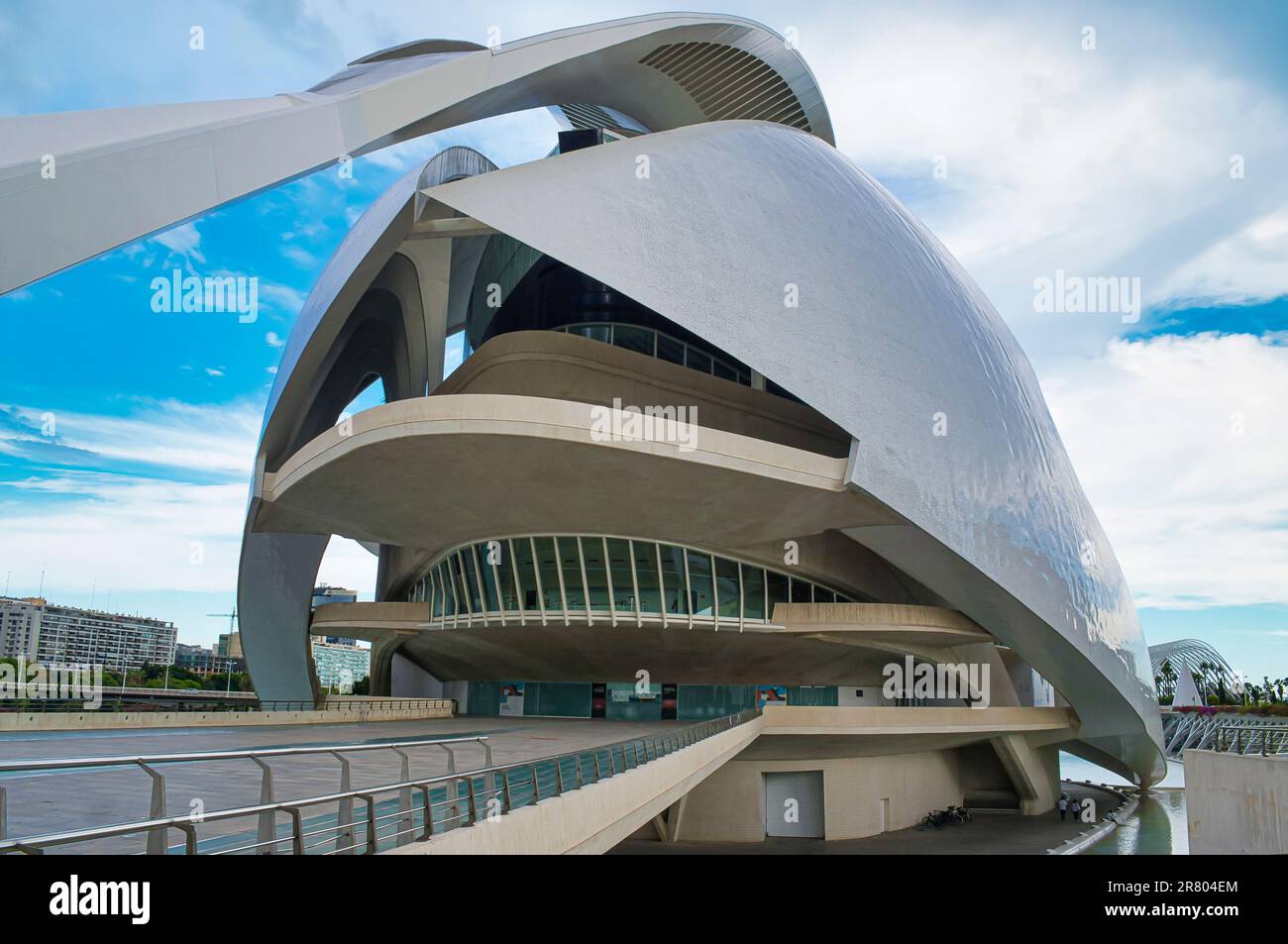 A modern building facade with a curved design, resembling a sailboat in ...