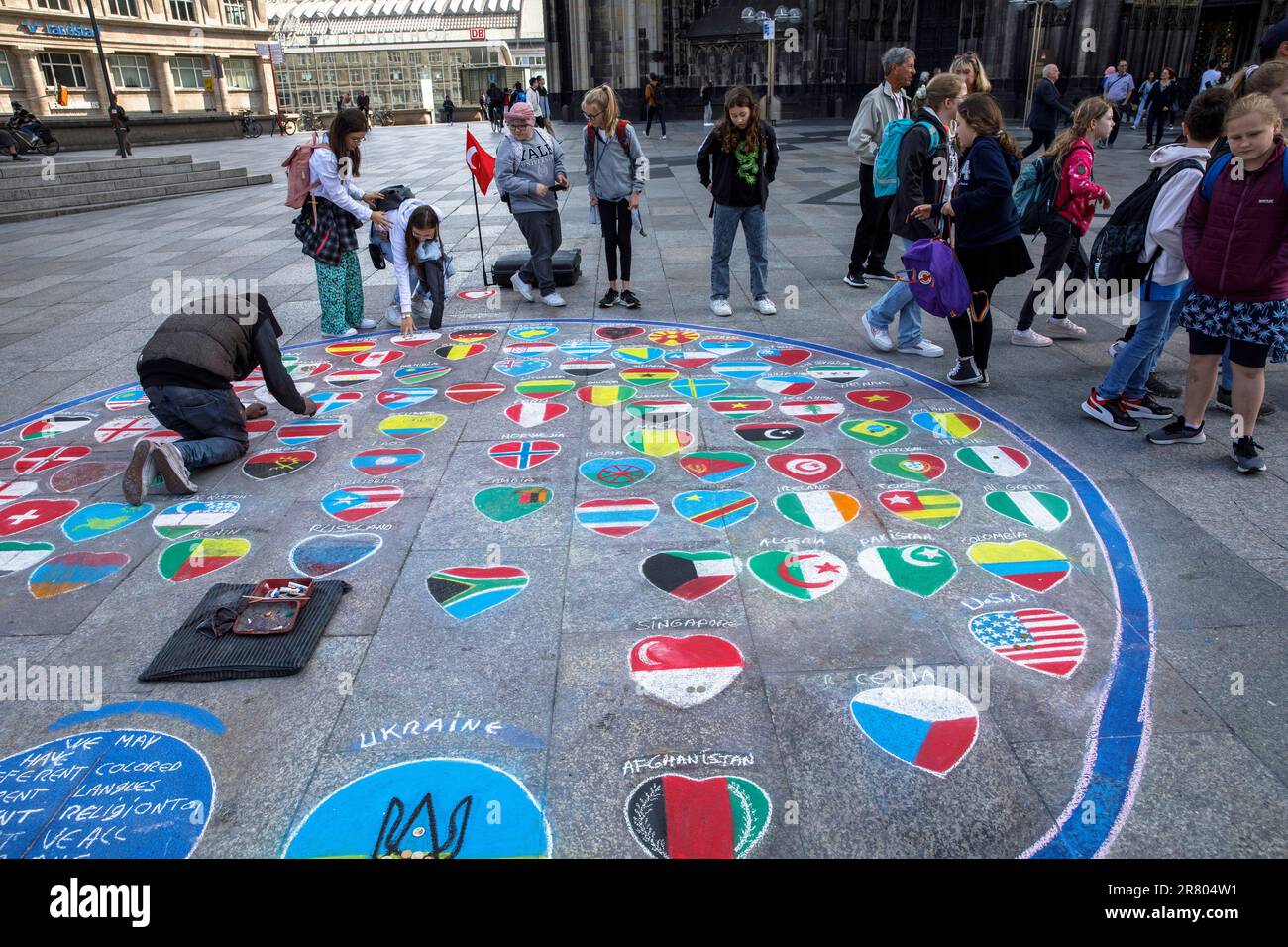 painting of a pavement painter in front of the cathedral, flags of ...