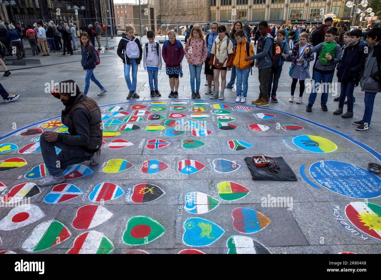 painting of a pavement painter in front of the cathedral, flags of ...