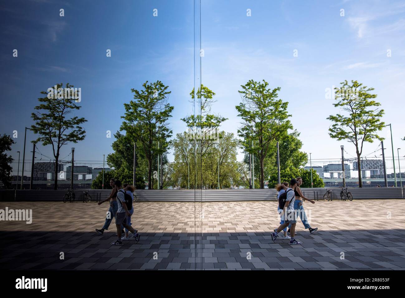 passers-by are reflected in the facade of the Lanxess Tower at ...