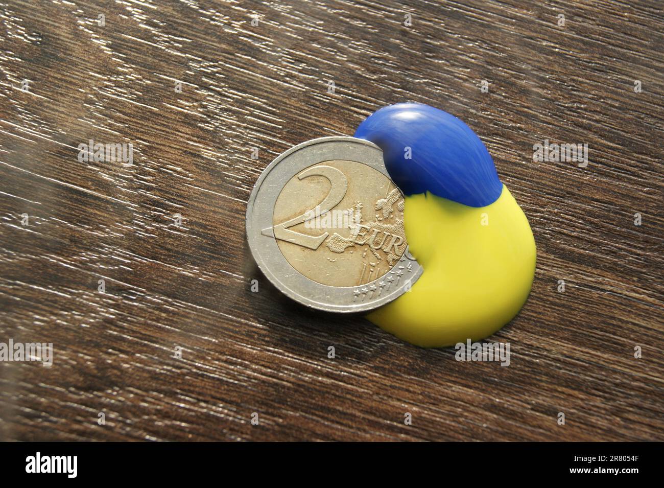 The colors of the Ukrainian flag on the 2 euro coin. 2 Euro coin on a ...