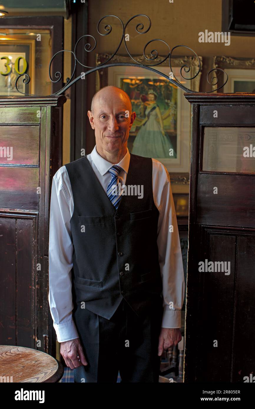 Waiter at the traditional restaurant and pub Guinea Grill in Mayfair ...