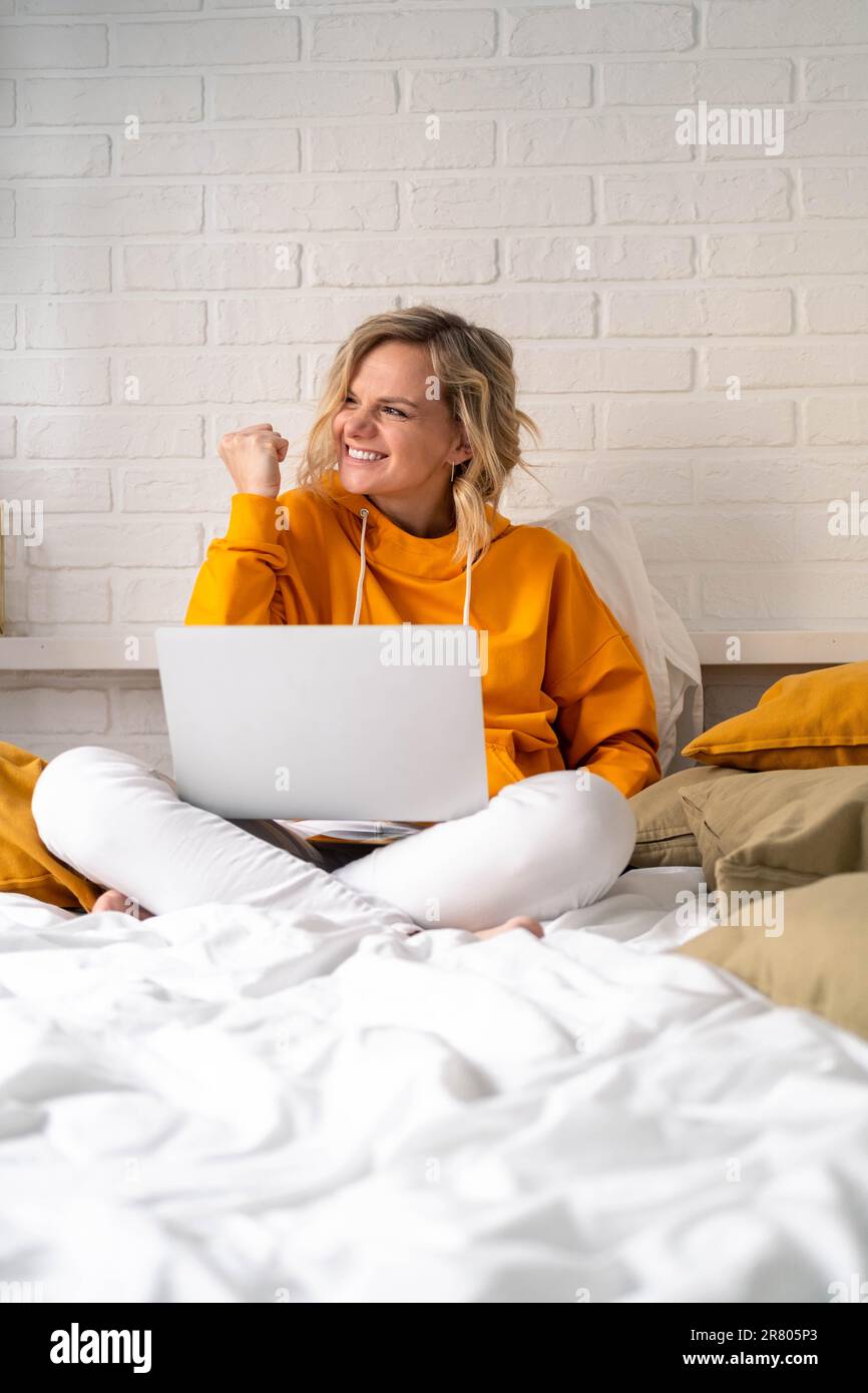Excited overjoyed woman girl Using computer laptop working office work ...
