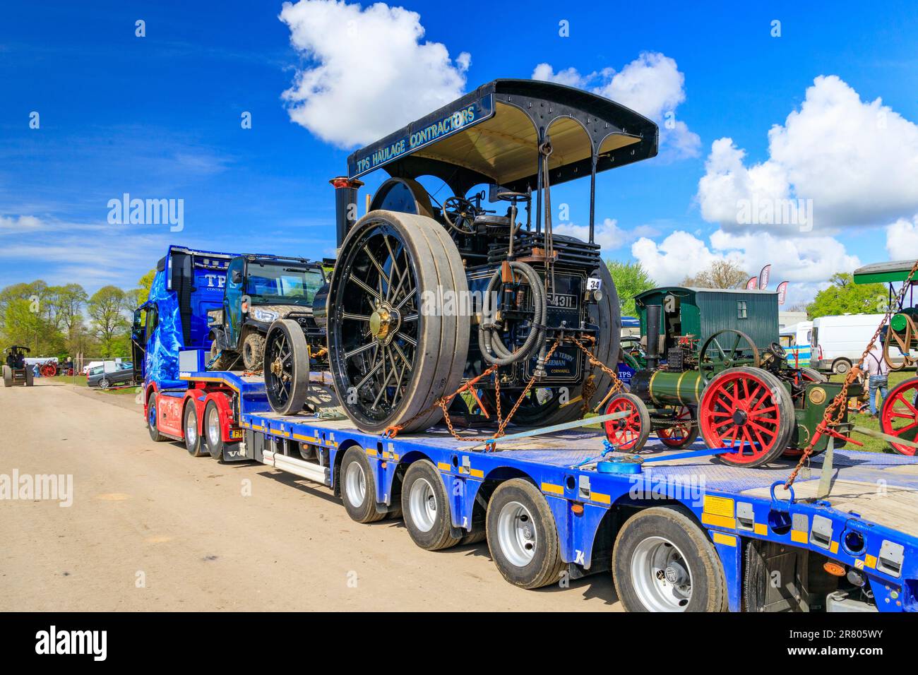 Two traction engines being taken home on a low loader from Abbey Hill ...