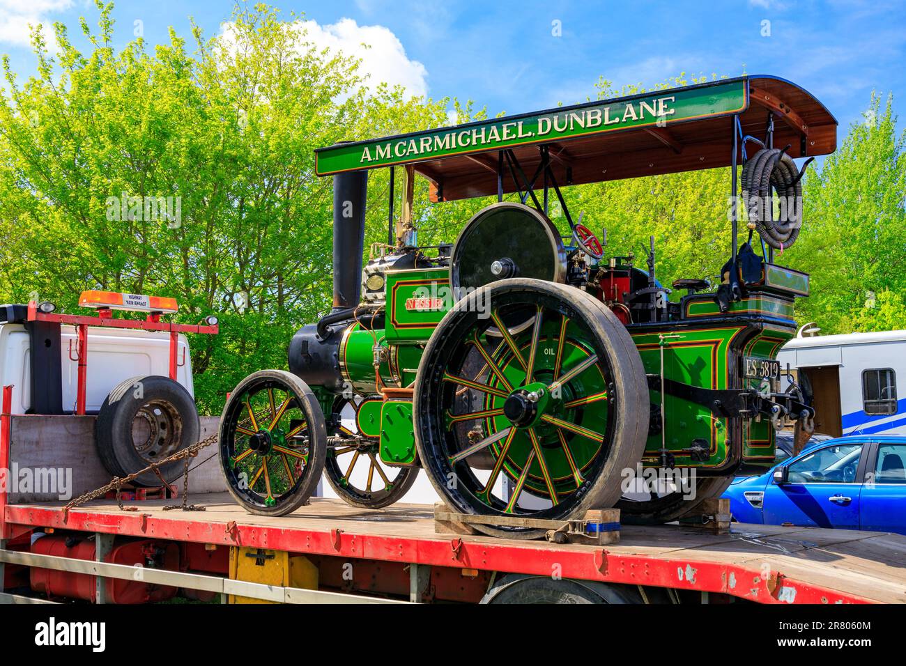 A traction engine being taken home on a low loader from Abbey Hill ...