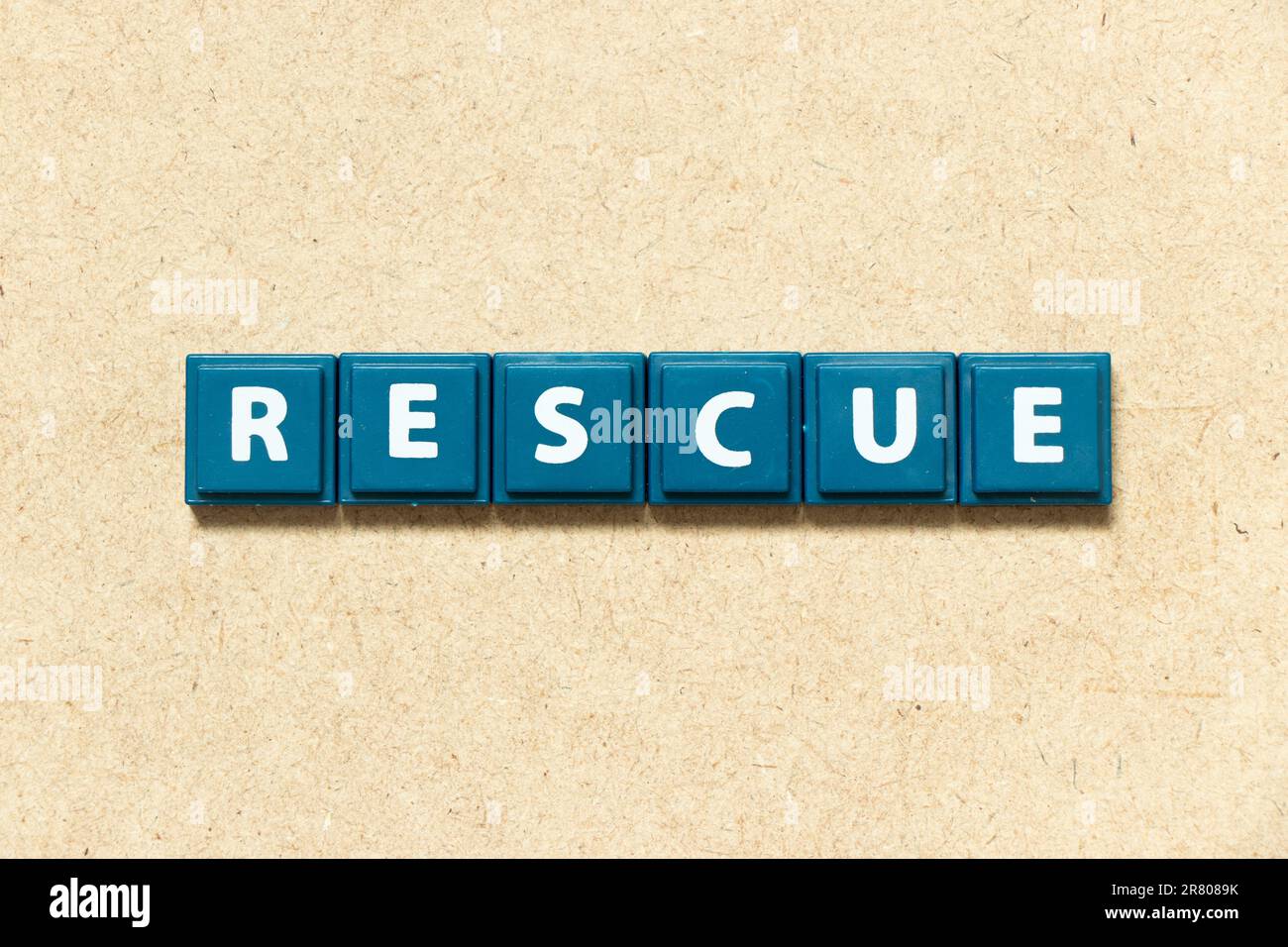 Tile alphabet letter in word rescue on wood background Stock Photo - Alamy