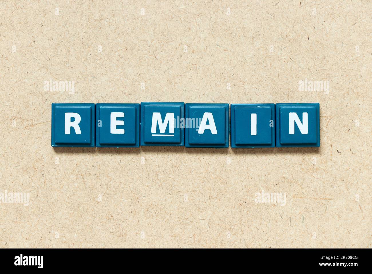 Tile alphabet letter in word remain on wood background Stock Photo - Alamy