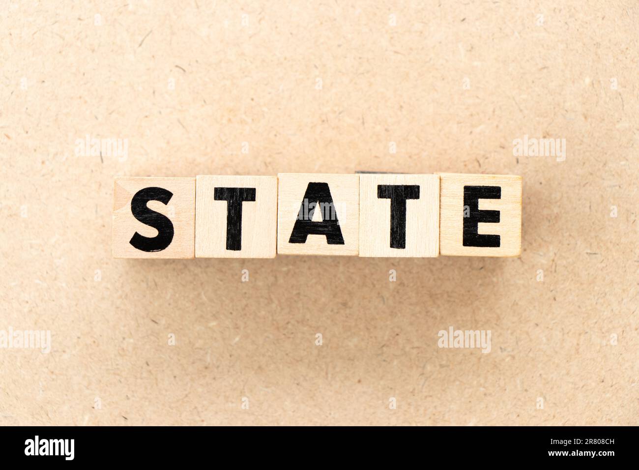 Alphabet letter block in word state on wood background Stock Photo - Alamy