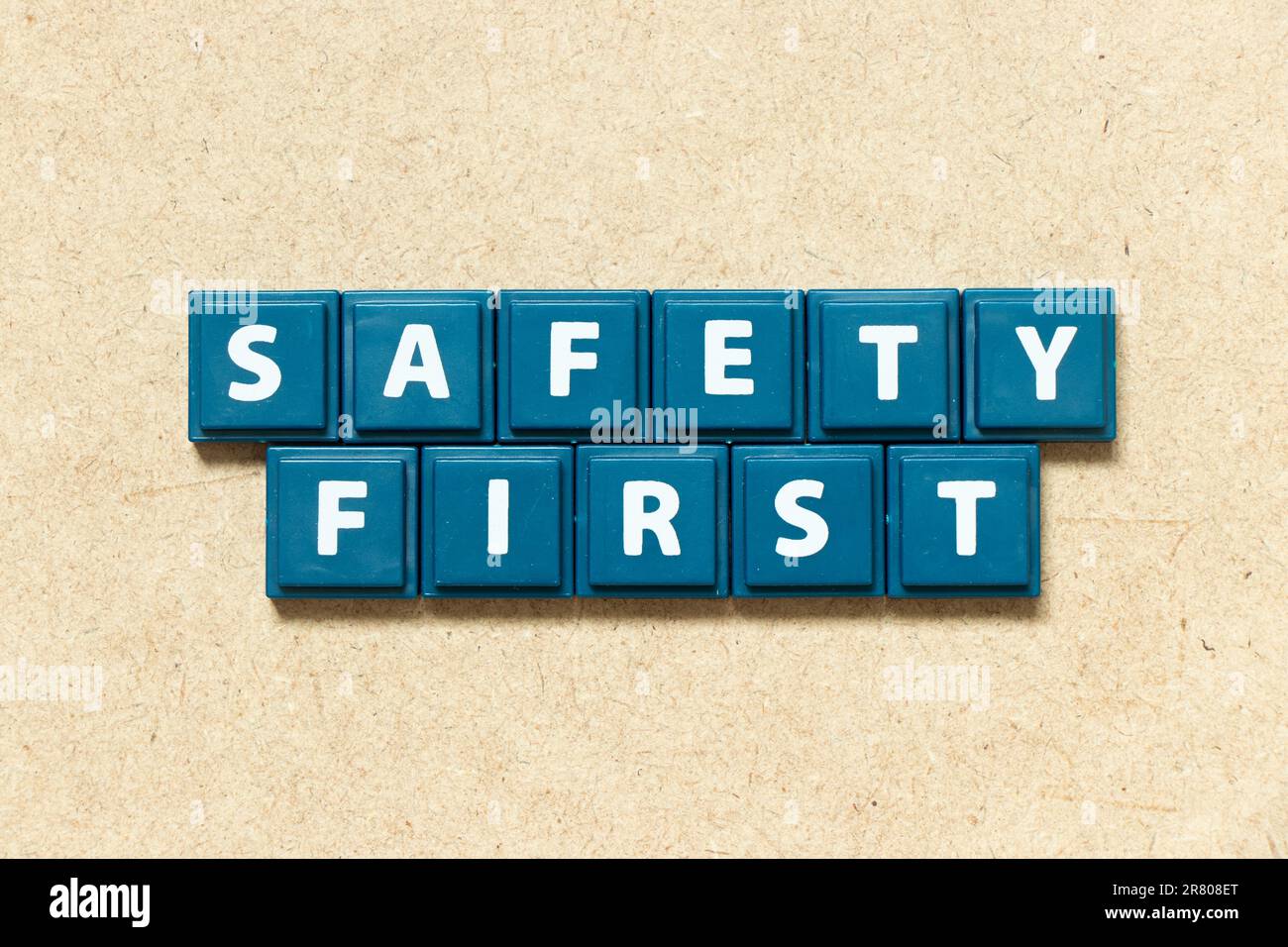 Tile alphabet letter in word safety first on wood background Stock ...