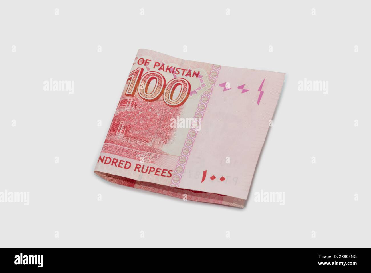 Currency notes in Pakistani Rupees - 100 rupees note on white ...