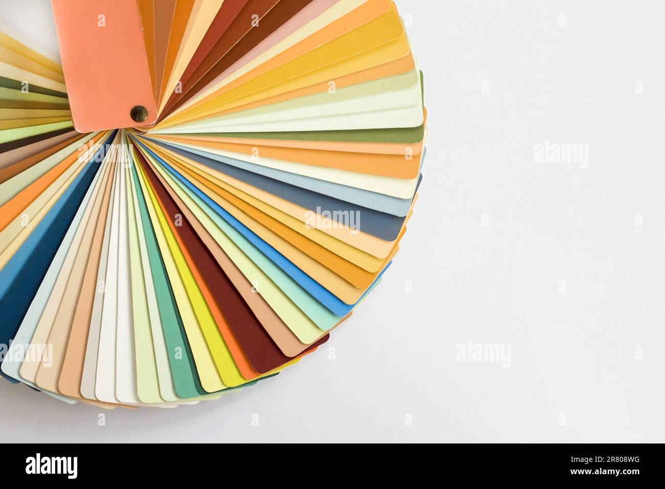 Color catalog made of cardboard, on a white surface with copy space ...