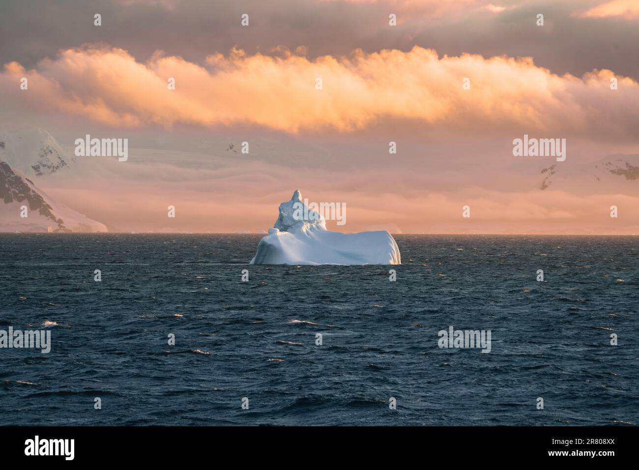 Beautiful iceberg floating in the water. Photo taken at sunset in ...