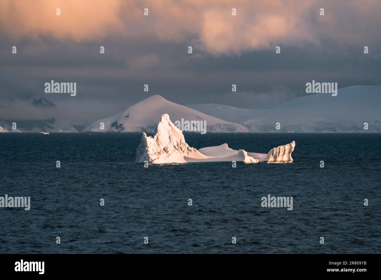 Beautiful iceberg floating in the water. Photo taken at sunset in ...